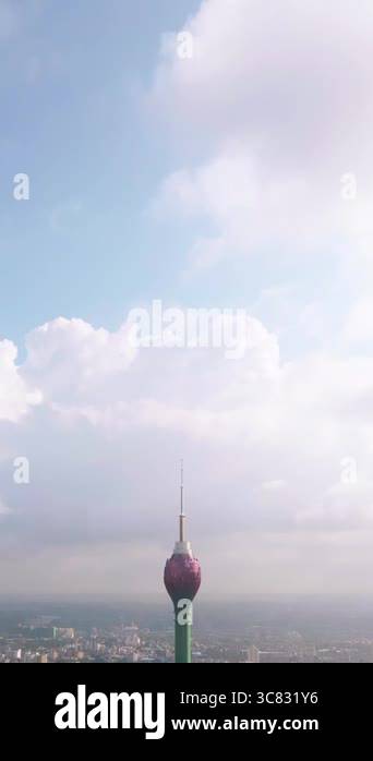 Dramatic tilt down drone shot of the Lotus Tower in Colombo, Sri Lanka ...