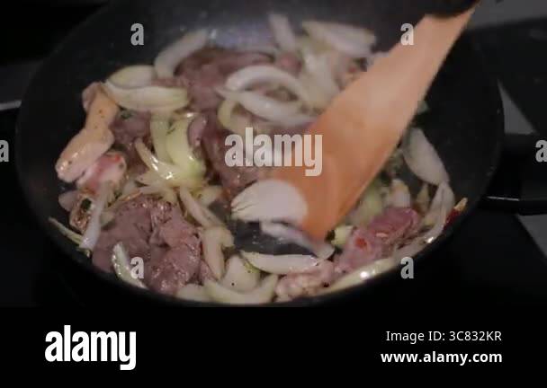 process of cooking hot potatoes with cream meat with fried onions put ...