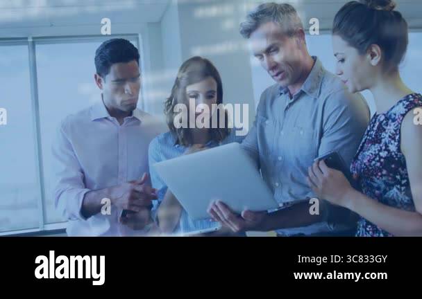 Business team collaborating over laptop with data processing animation ...