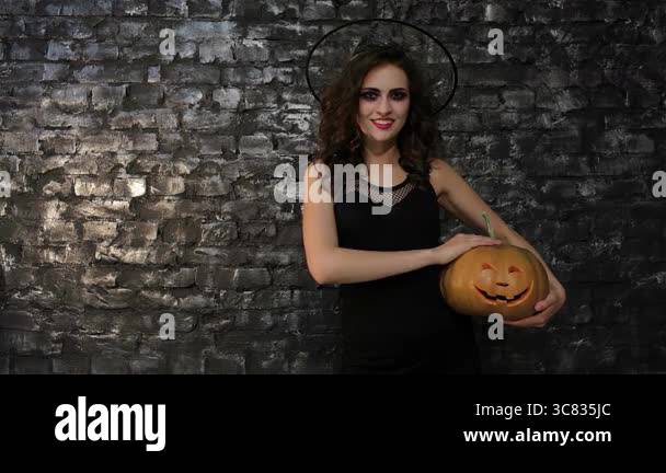 A captivating woman sorceress poses confidently against a textured ...