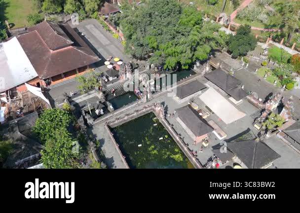 Aerial view of Tirta Empul Temple in Ubud, Bali, Indonesia, with people ...