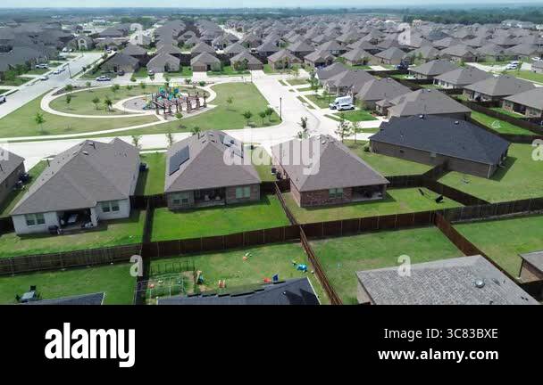 Flyover new construction two story houses with solar roofing and ...