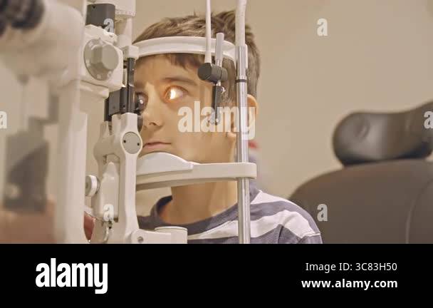 Little boys eye examination at optometrist ophthalmologist using ...