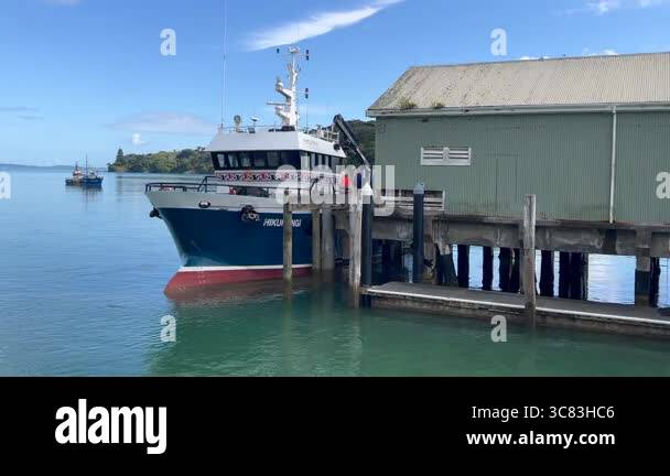 MANGONUI - TAIPA, NZL - FEN 12 2025:Fishing boat mooring beside ...