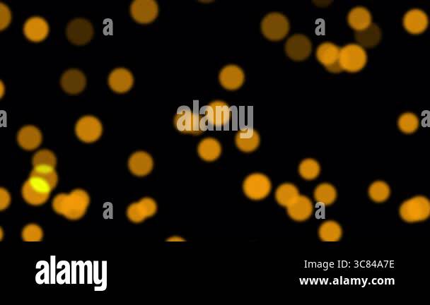Abstract animation loop glow orange gold bokeh particles flow up on ...
