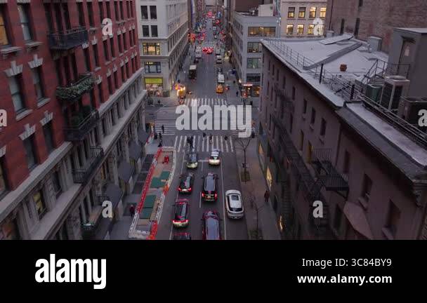 Bustling New York City street scene with traffic moving, pedestrians ...