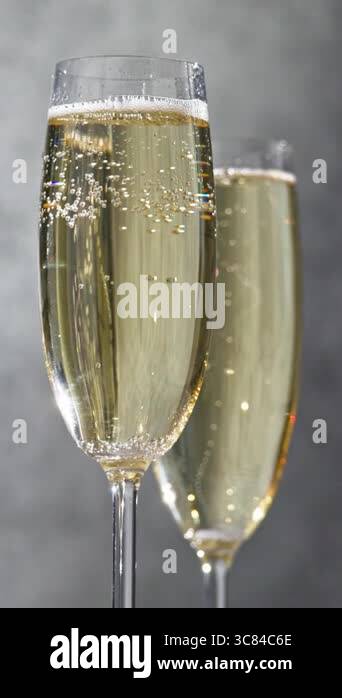 fresh sparkling champagne in glasses on grey background, closeup Stock ...