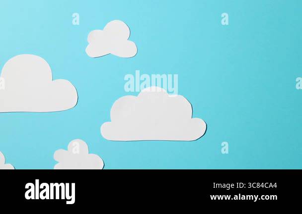 stop motion video animation made from white paper clouds on blue sky ...