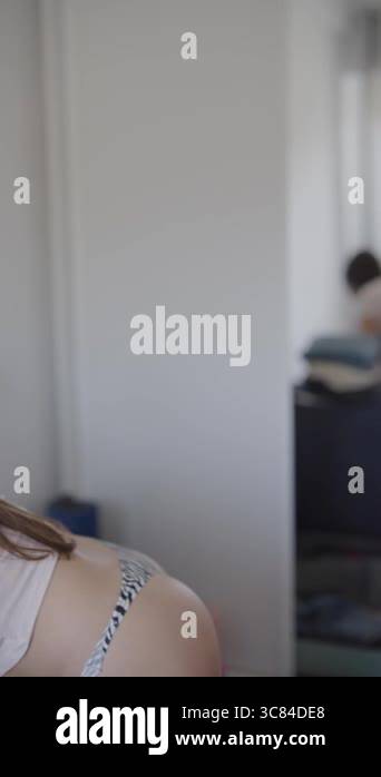 A casual and intimate scene takes place in a bright room, beautifully ...