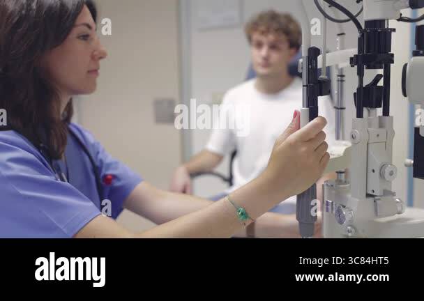 An ophthalmologist conducts an eye examination using advanced medical ...