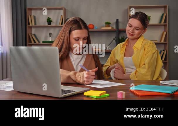 Daily lifestyle concept. Young teenage girl studying at home, girl with ...