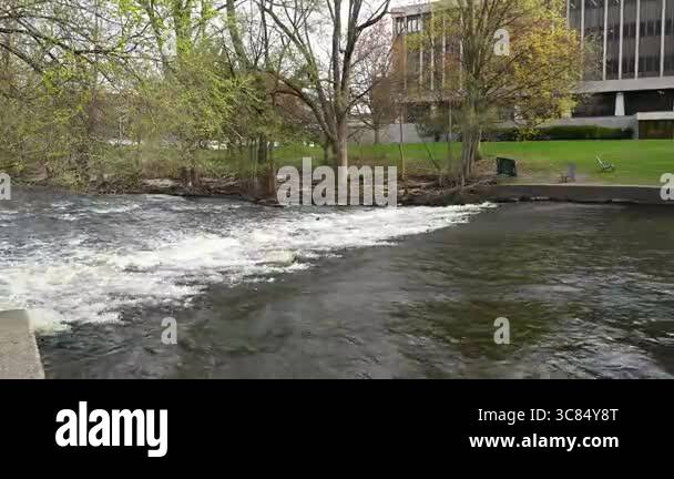 Flowing smooth water on the Red Cedar River at Michigan State ...