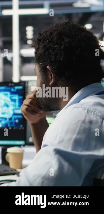 Vertical video Server room admin with disability interprets machine learning generated data ...