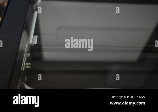 The scanning head of the office scanner performs the scanning process ...