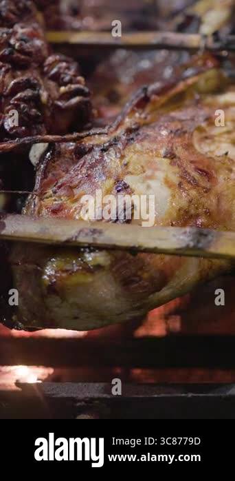 Roast calf carcass on coals in party Stock Video Footage - Alamy