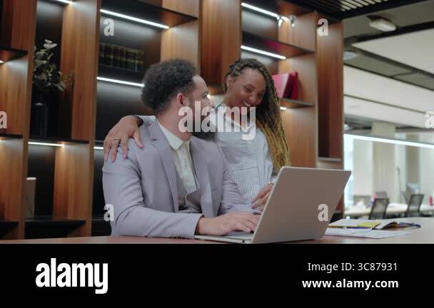 A cheerful interaction takes place between a businessman and a ...