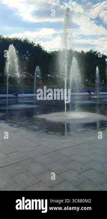Odessa Ukraine, July 2, 2023: Children running under jets of water from ...