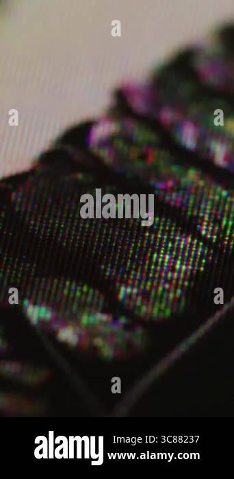 Vertical video. Transition paint. Ink flow. Black opaque liquid spread on light mesh surface ...