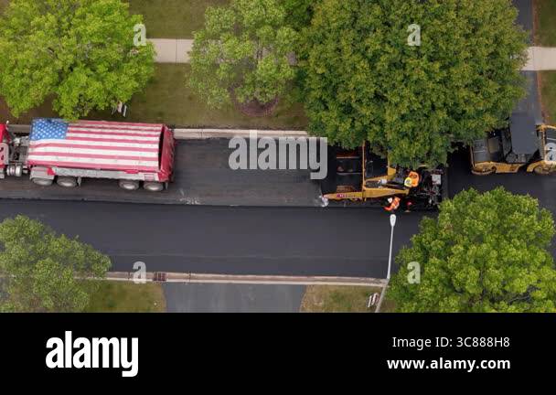 Roadwork development of new asphalt road and real estate houses at ...