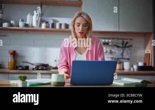 Girl video calling laptop at cozy kitchen closeup. Smiling woman ...