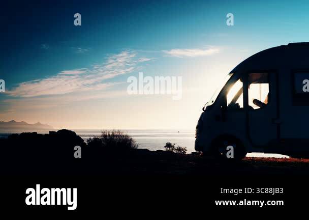 Camper vehicle camping by sea in the morning. Traveling by motorhome ...