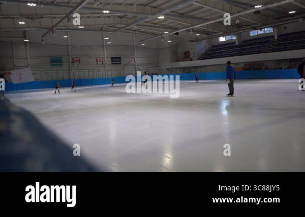 Ice Speed Skating. Children on the ice arena. Skates winter Sport child ...