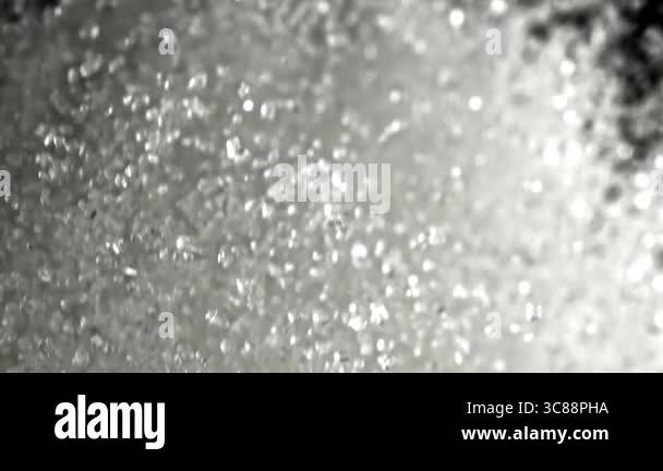 Sugar flies up and down. Filmed on a high-speed camera at 1000 fps ...