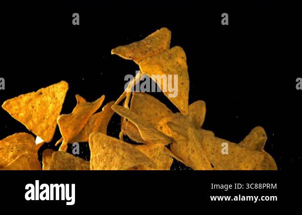 Corn chips fly up and fall down. Filmed on a high-speed camera at 1000 ...