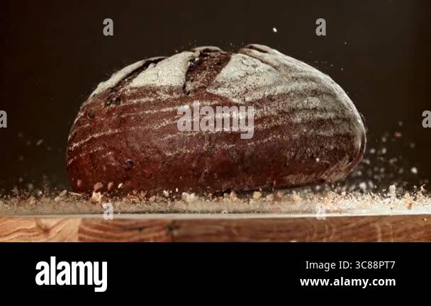 Bread on a cutting board. Filmed on a high-speed camera at 1000 fps ...