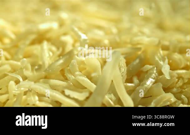The grated cheese falls down. Filmed on a high-speed camera at 1000 fps ...