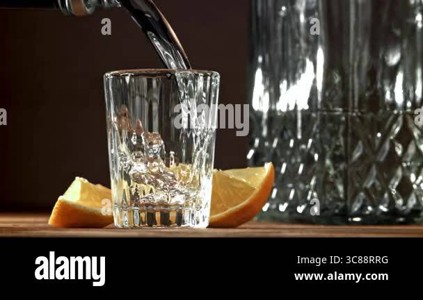 Vodka with a slice of lemon. Filmed on a high-speed camera at 1000 fps ...