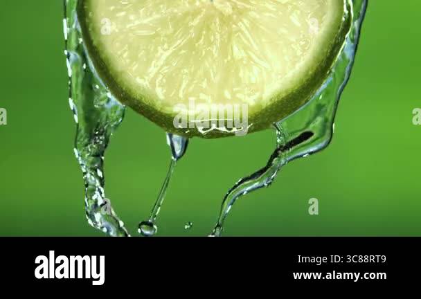 Water drips off half a lime. Filmed on a high-speed camera at 1000 fps ...