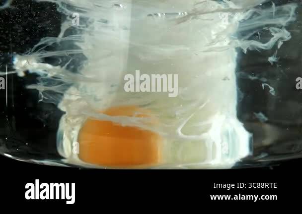 Cooking poached eggs. Filmed on a high-speed camera at 1000 fps. High ...