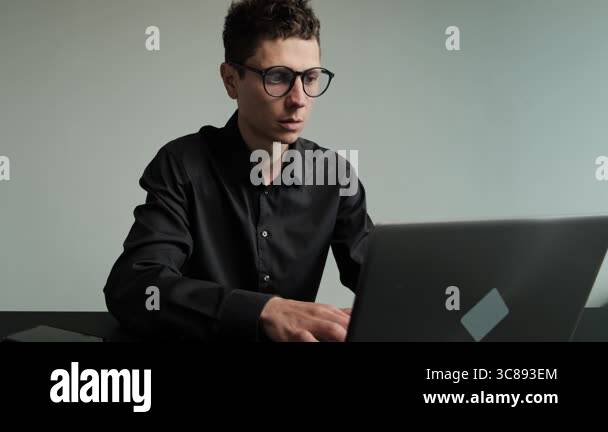 Young man in glasses suffering from muscles tension, having painful ...