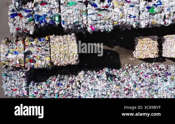Kudums, Latvia - April 28, 2025 - Aerial view of sorted and compressed ...