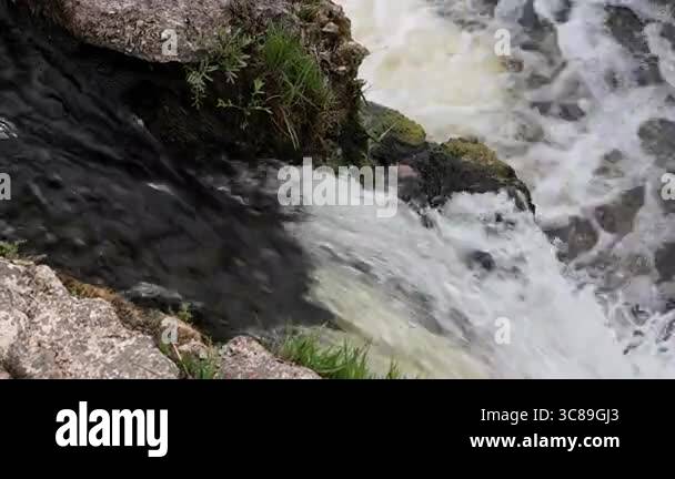 Kuldiga, Latvia Water flowing over the Venta River waterfall, the ...
