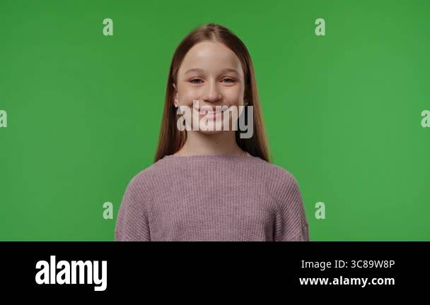 Teens emotions concept. Teenage girl posing at camera smiling, positive ...