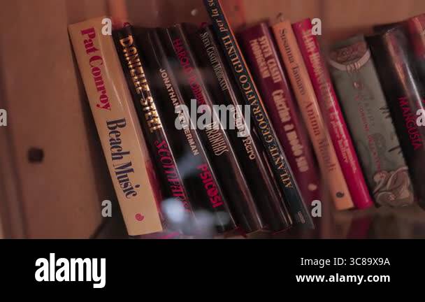 Rome, italy 4 may 2025: light reflecting off glass shelves revealing ...