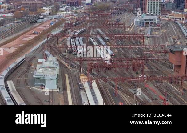 Aerial view capturing metropolitan train depot, revealing intersecting ...