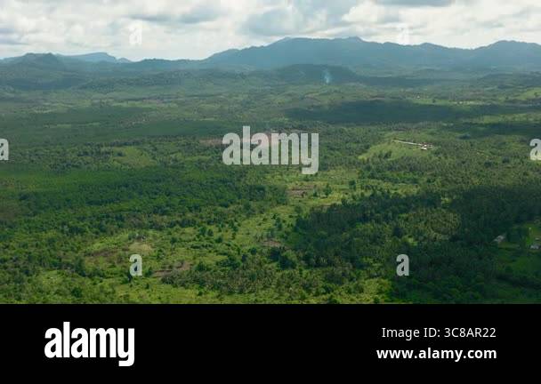 Aerial view of mountain slopes with rainforest and a mountain valley ...