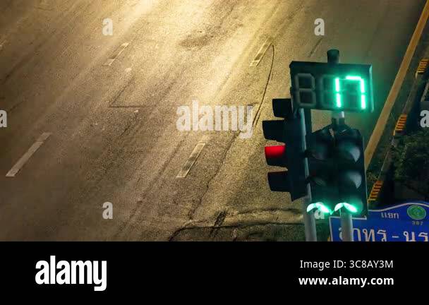 timelapse of rush hour traffic at a busy junction in central bangkok at ...
