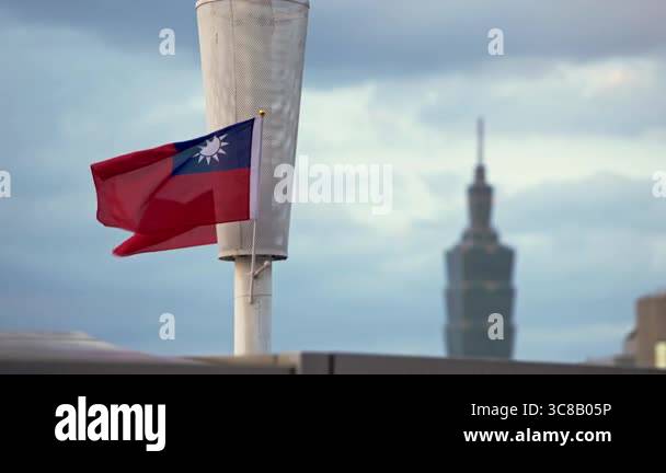 Slow motion of Taiwan national flag waving prominently on a pole with ...
