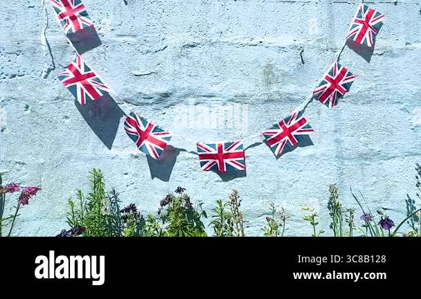 Ve Day celebrations union jack bunting flying in the wind Stock Video ...