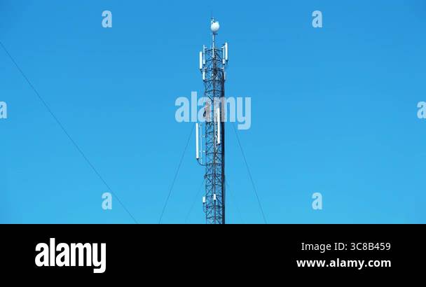 Workers repair a cell tower. High-altitude work. Workmen at the work ...