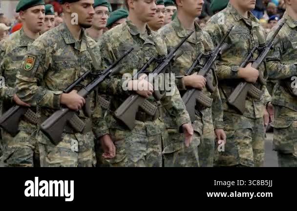 VIENNA, AUSTRIA - OCTOBER 26 2024: Soldiers with machine guns walk on ...