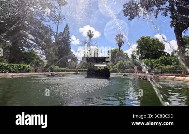 Enjoy a peaceful moment at a garden in Valletta, Malta, featuring a ...