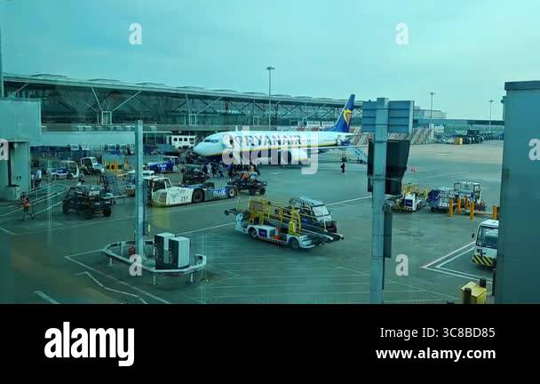 International airport scene with plane ready for boarding and ...