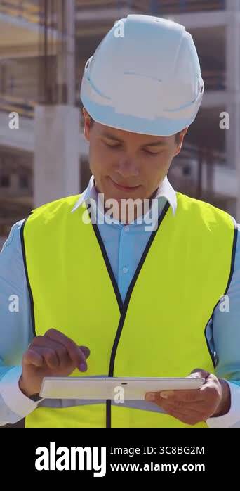 Professional builder standing in front of construction site. Foreman in ...