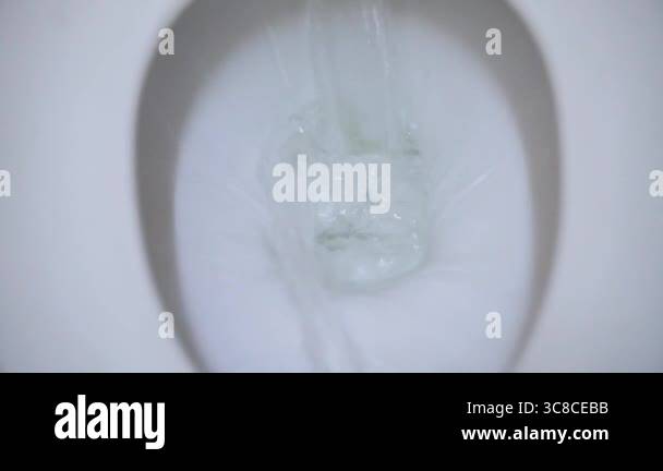 Man's hand flushes the toilet tank, the concept of hygiene and ...