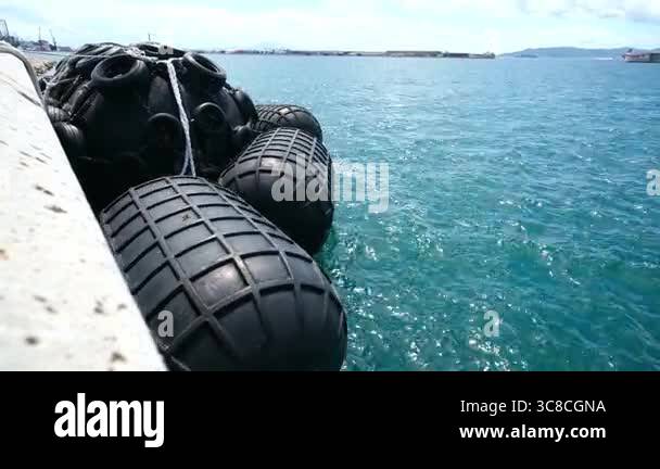 Wide angle view of quayside equipment at Gibraltar. Floating pneumatic ...